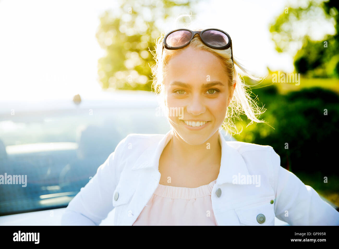 happy teenage girl or young woman near car Stock Photo - Alamy