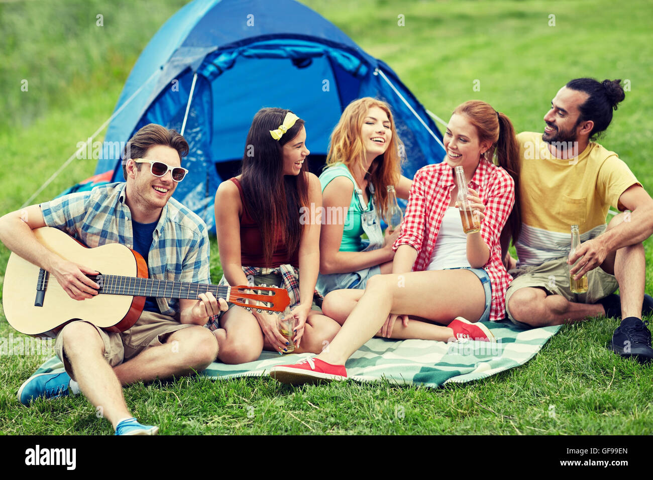 Camping friends playing camper music hi-res stock photography and ...