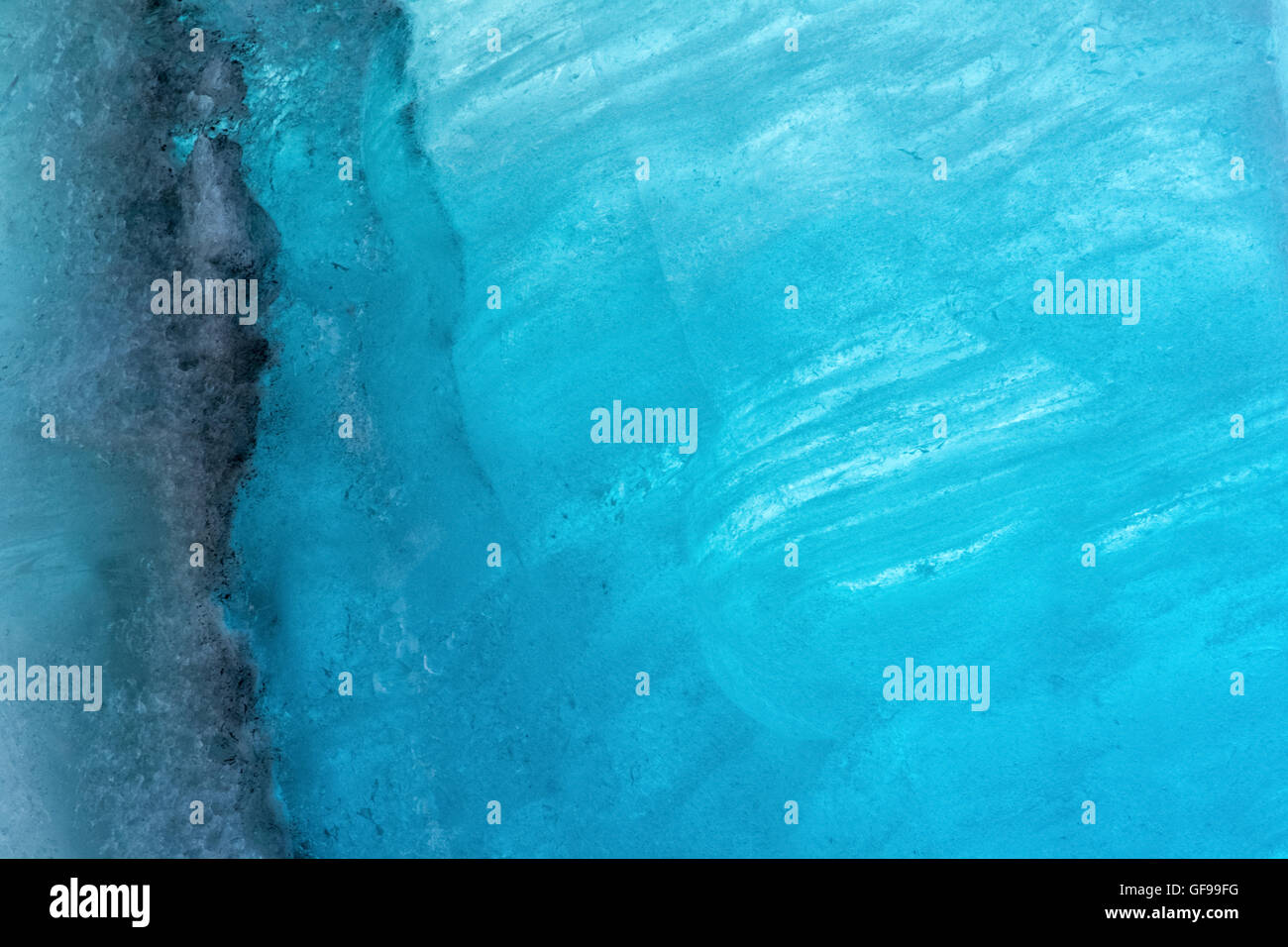 Blue light filters through the layers of ice Stock Photo - Alamy