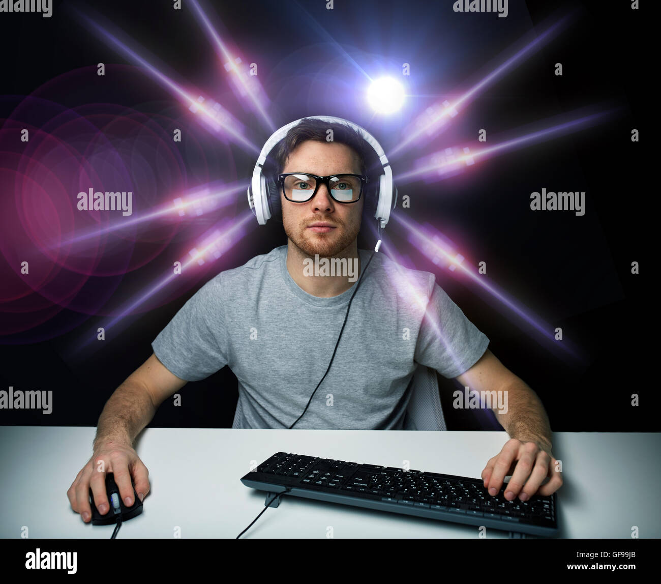 man in headset playing computer video game Stock Photo - Alamy