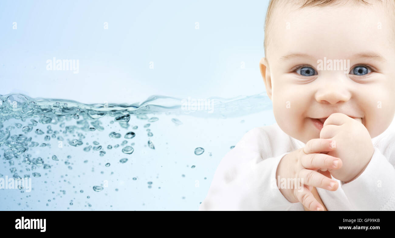 happy baby over blue background with water splash Stock Photo - Alamy