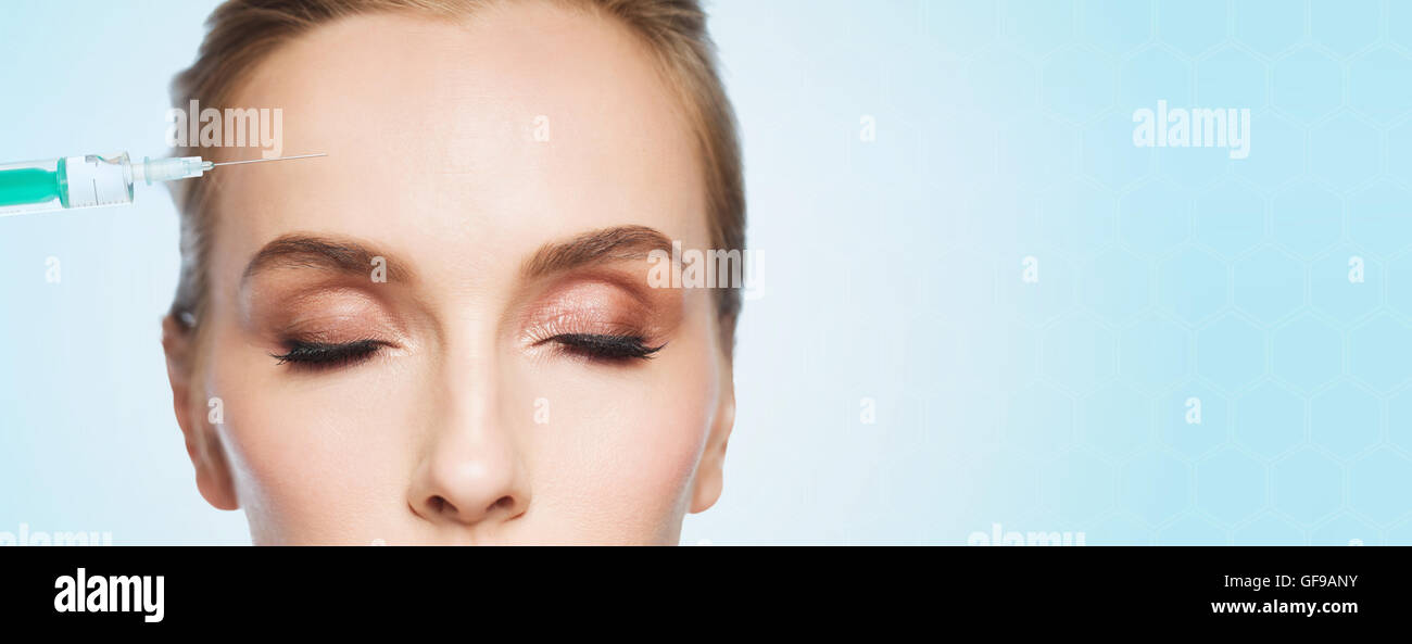 woman face and syringe making injection Stock Photo - Alamy