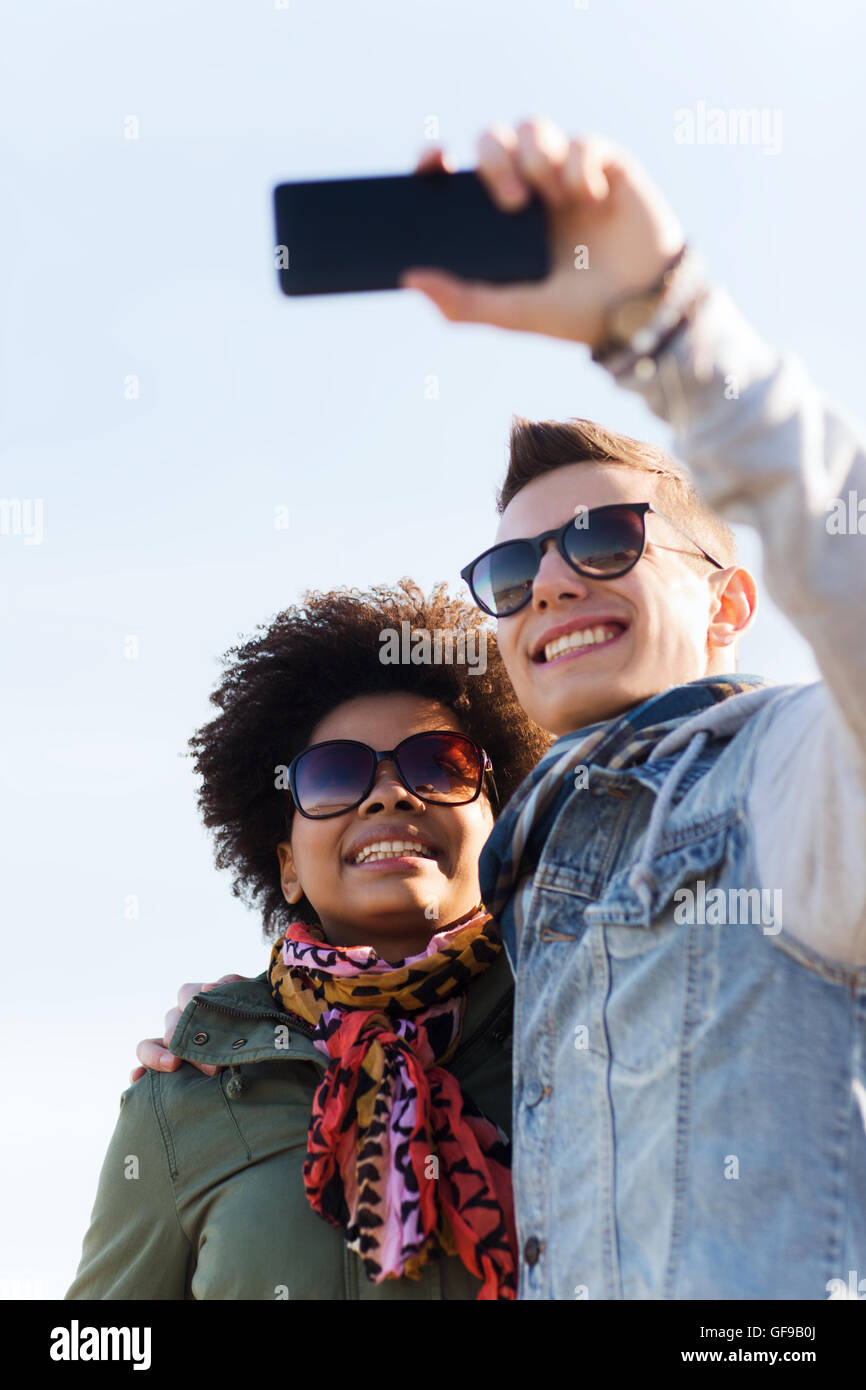 happy teenage friends in shades taking selfie Stock Photo - Alamy