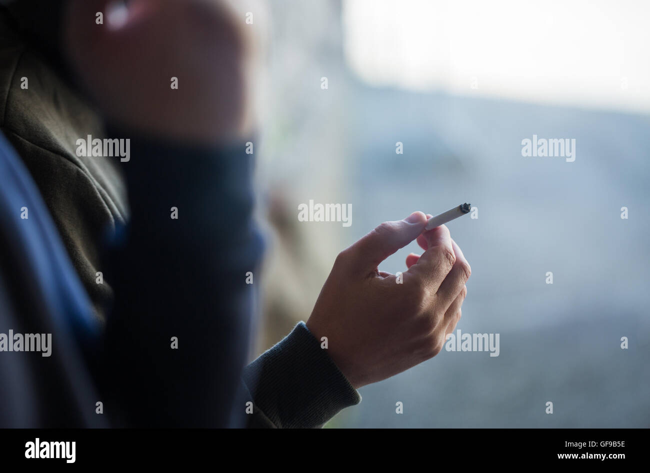 Hand smoking hi-res stock photography and images - Alamy