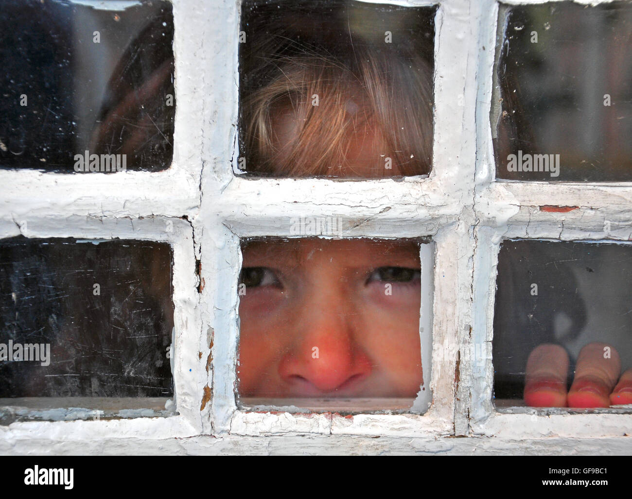 Child abuse sad face window hi-res stock photography and images - Alamy