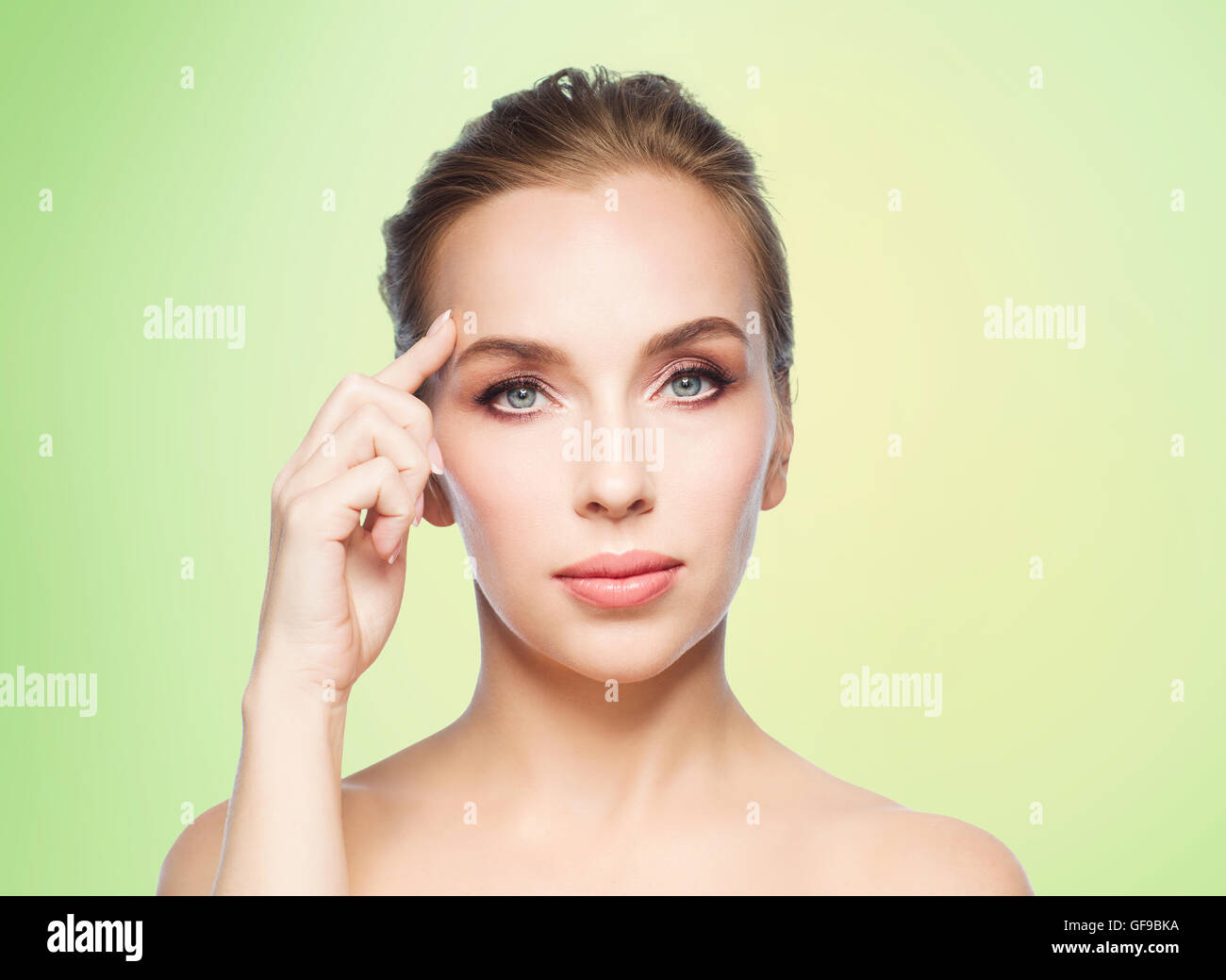 beautiful young woman showing her forehead Stock Photo - Alamy