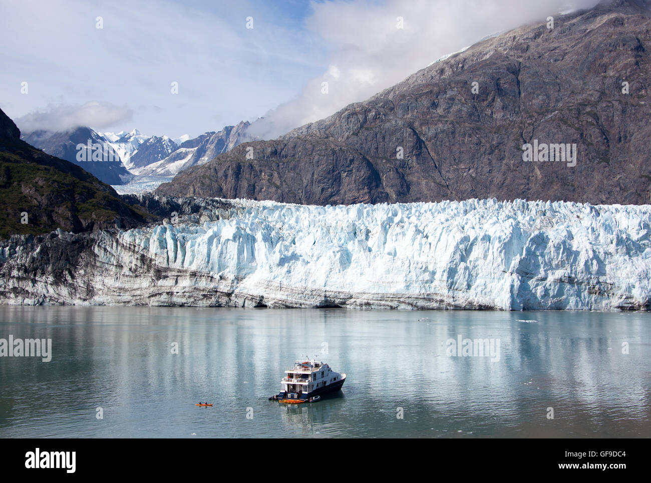 The small boat with tourists exploring Glacier Bay national park ...