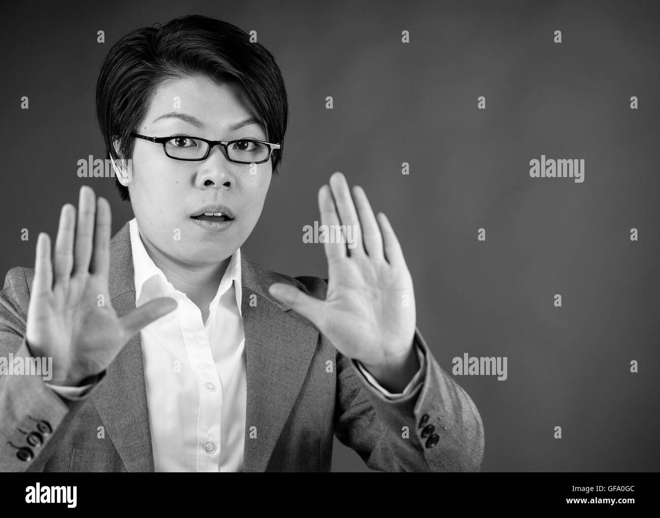 female model attractive woman on plain background with copy space halt ...