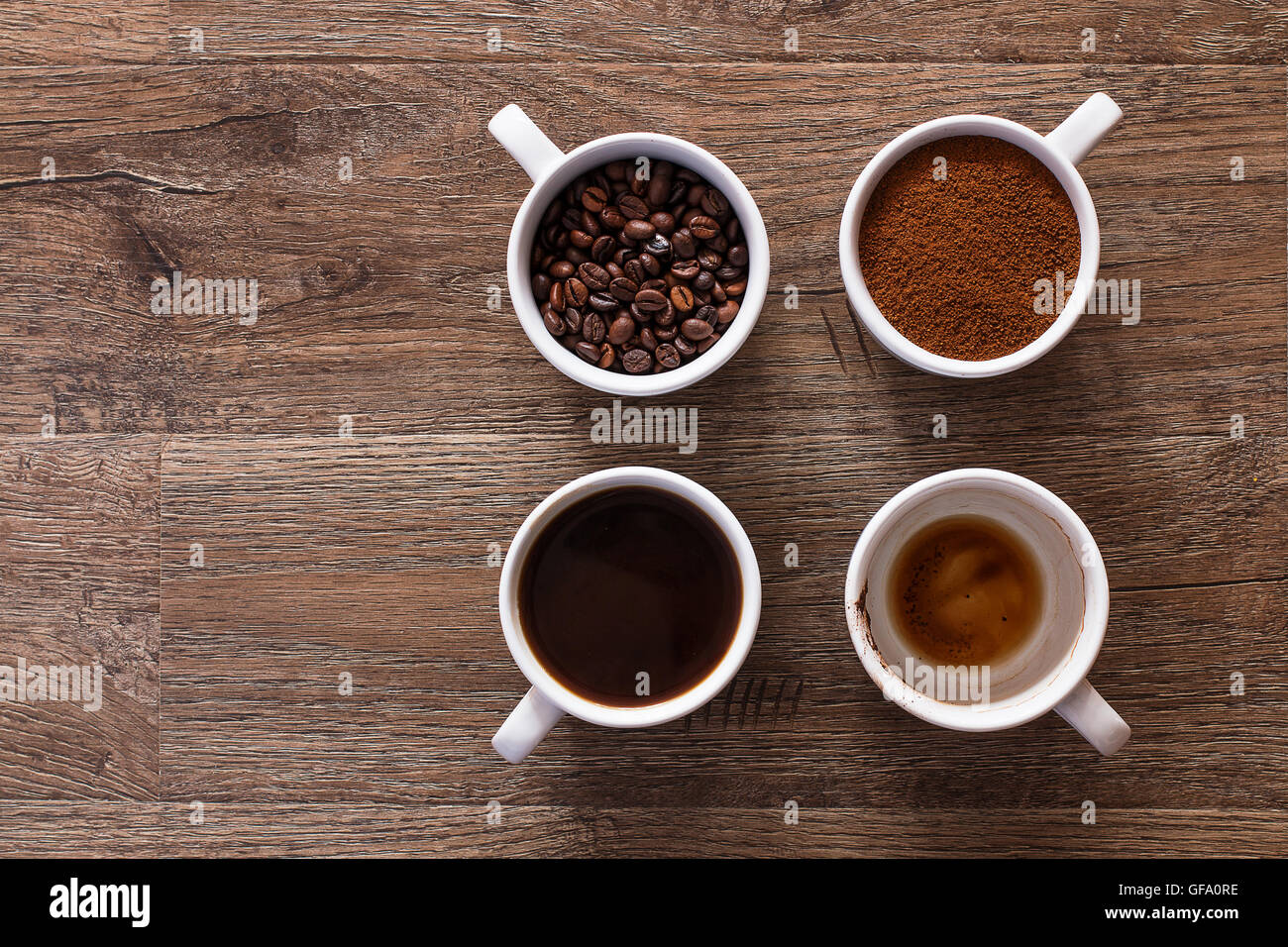 Four cups of coffee, drink phases - bean, ground and empty cup Stock ...