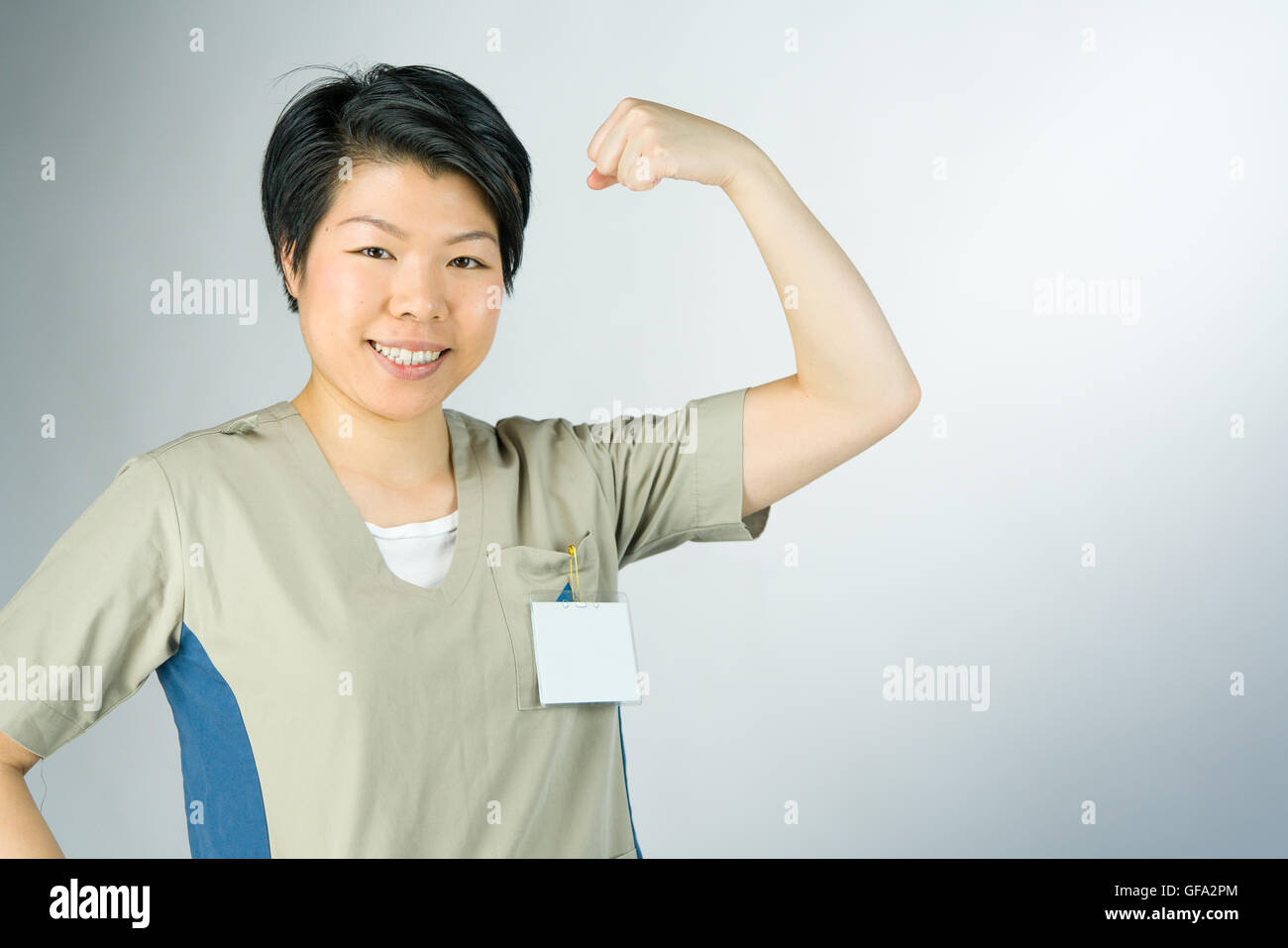 female model attractive woman showing strength with arm curl Stock ...