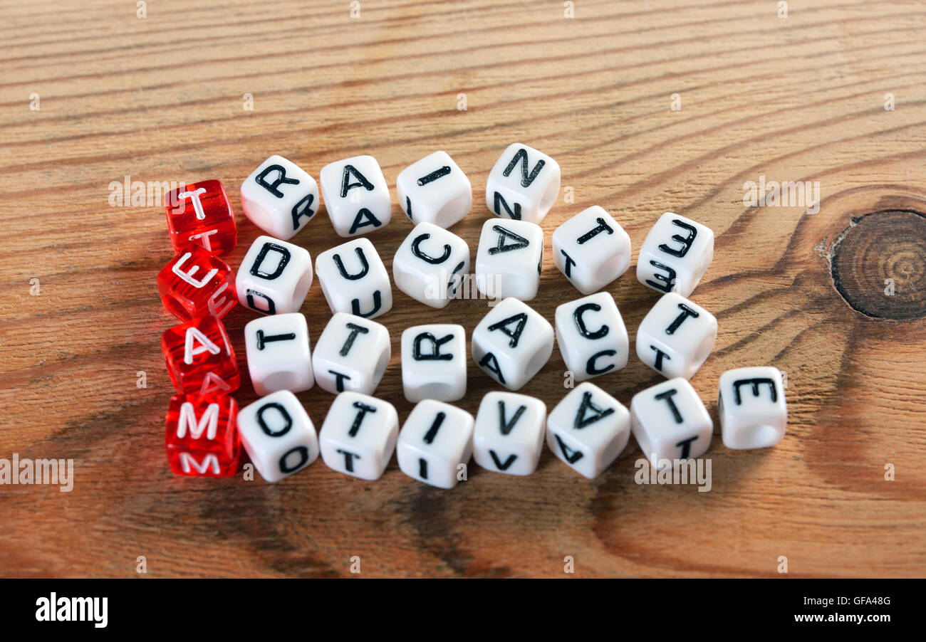 acronym of TEAM red and white dices on wood Stock Photo - Alamy