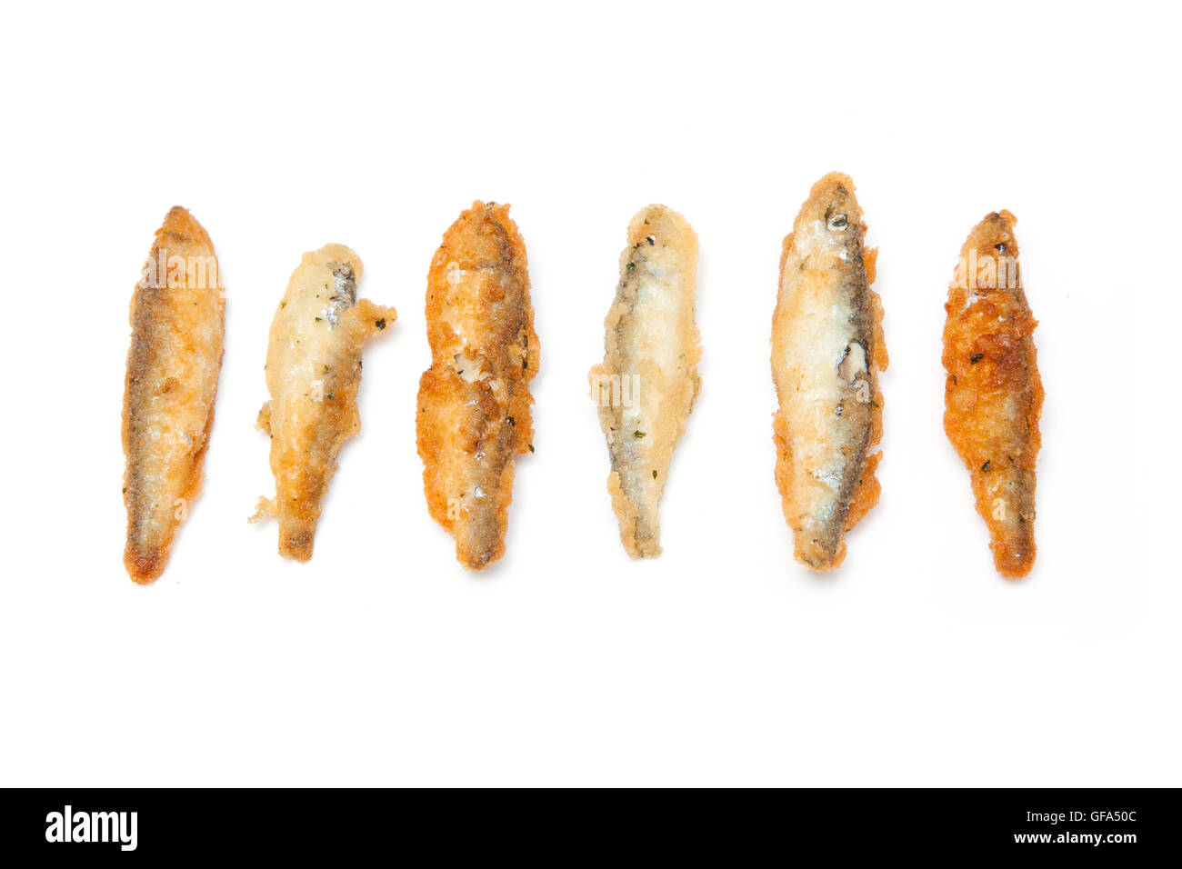 Battered whitebait sprats (Sprattus sprattus) isolated on a white ...