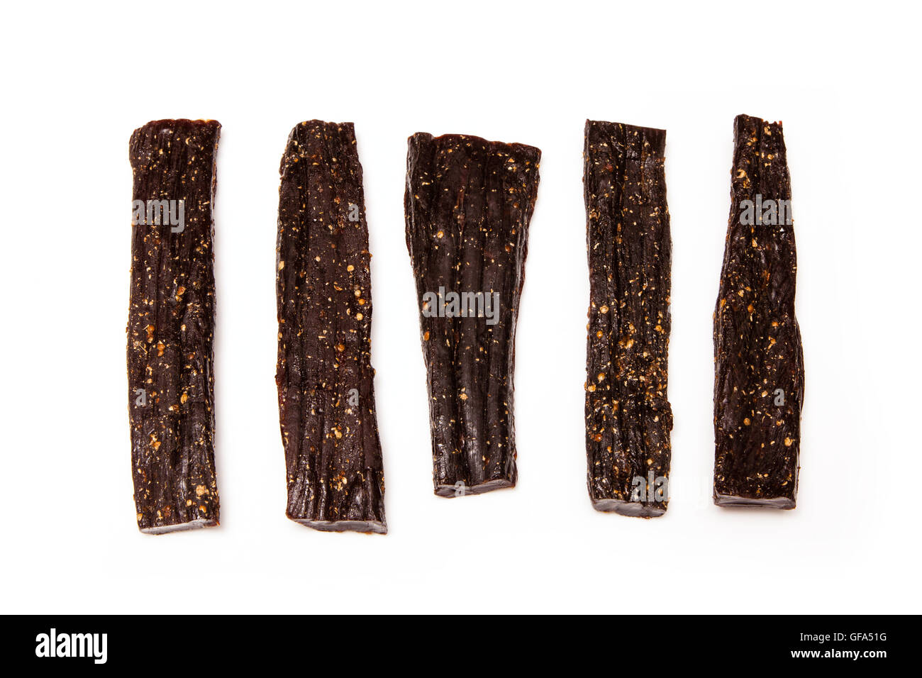 Beef Biltong sticks isolated on a white studio background Stock Photo ...