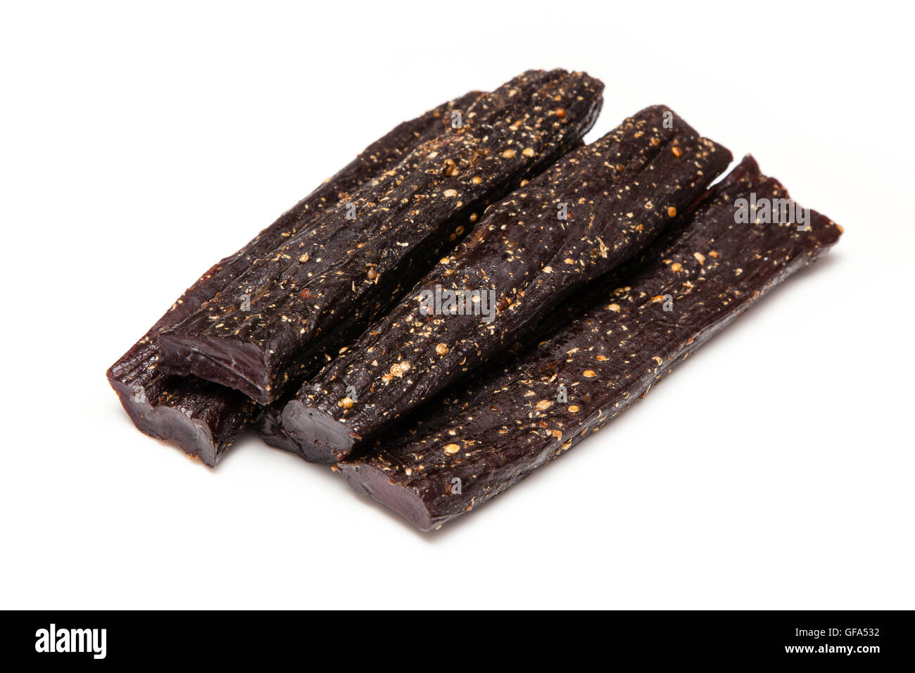 Beef Biltong sticks isolated on a white studio background Stock Photo ...