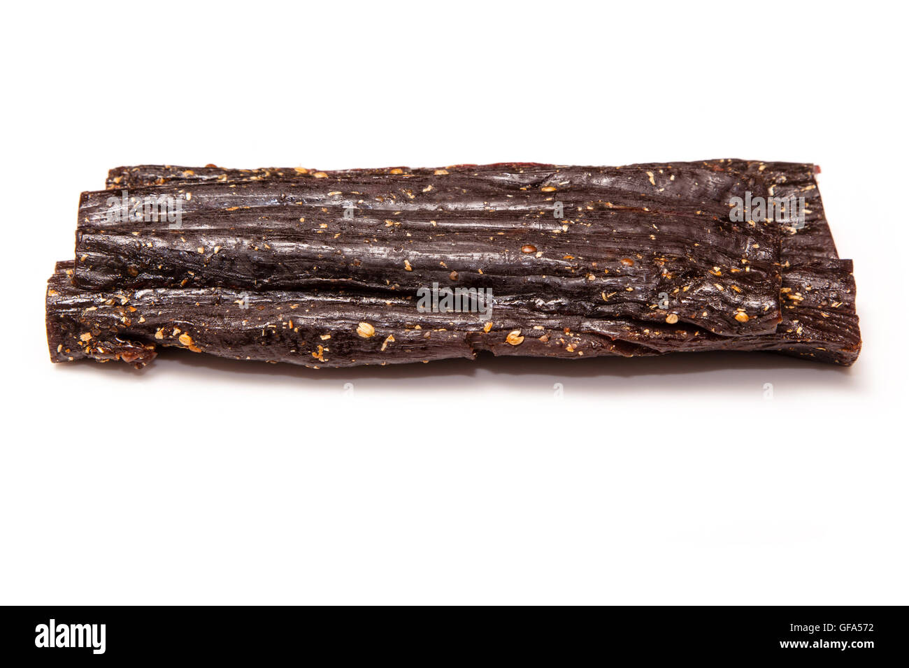 Beef Biltong sticks isolated on a white studio background Stock Photo ...