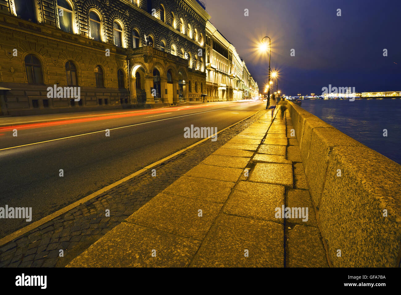 Quay road and stone wall at night Stock Photo - Alamy