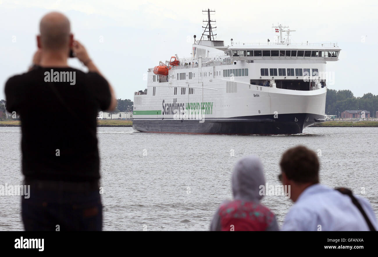 Rostock, Germany. 30th July, 2016. Passengers wait as the new hybrid ...