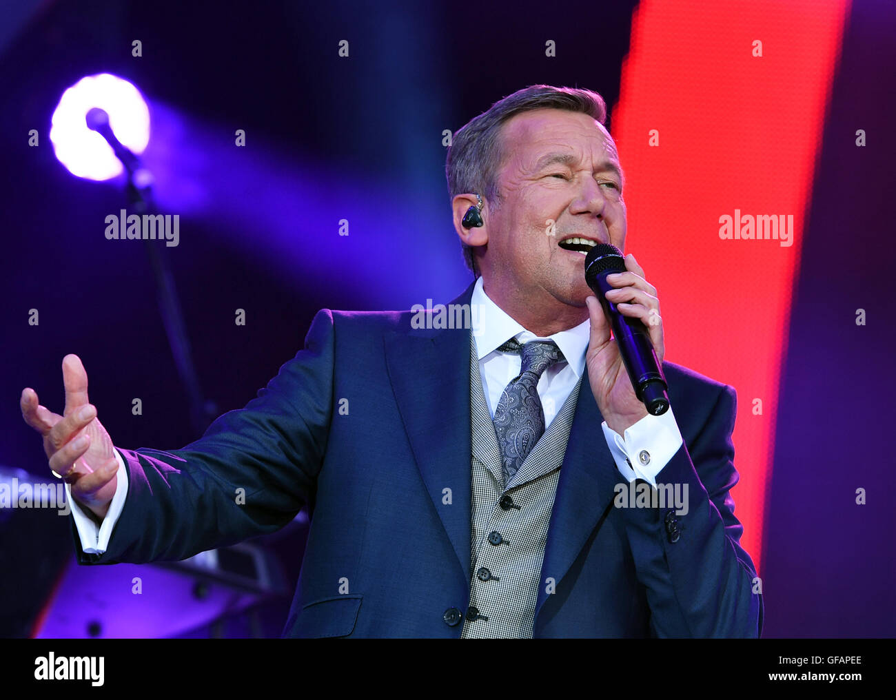 Dresden, Germany. 28th July, 2016. Singer Roland Kaiser stands on stage ...