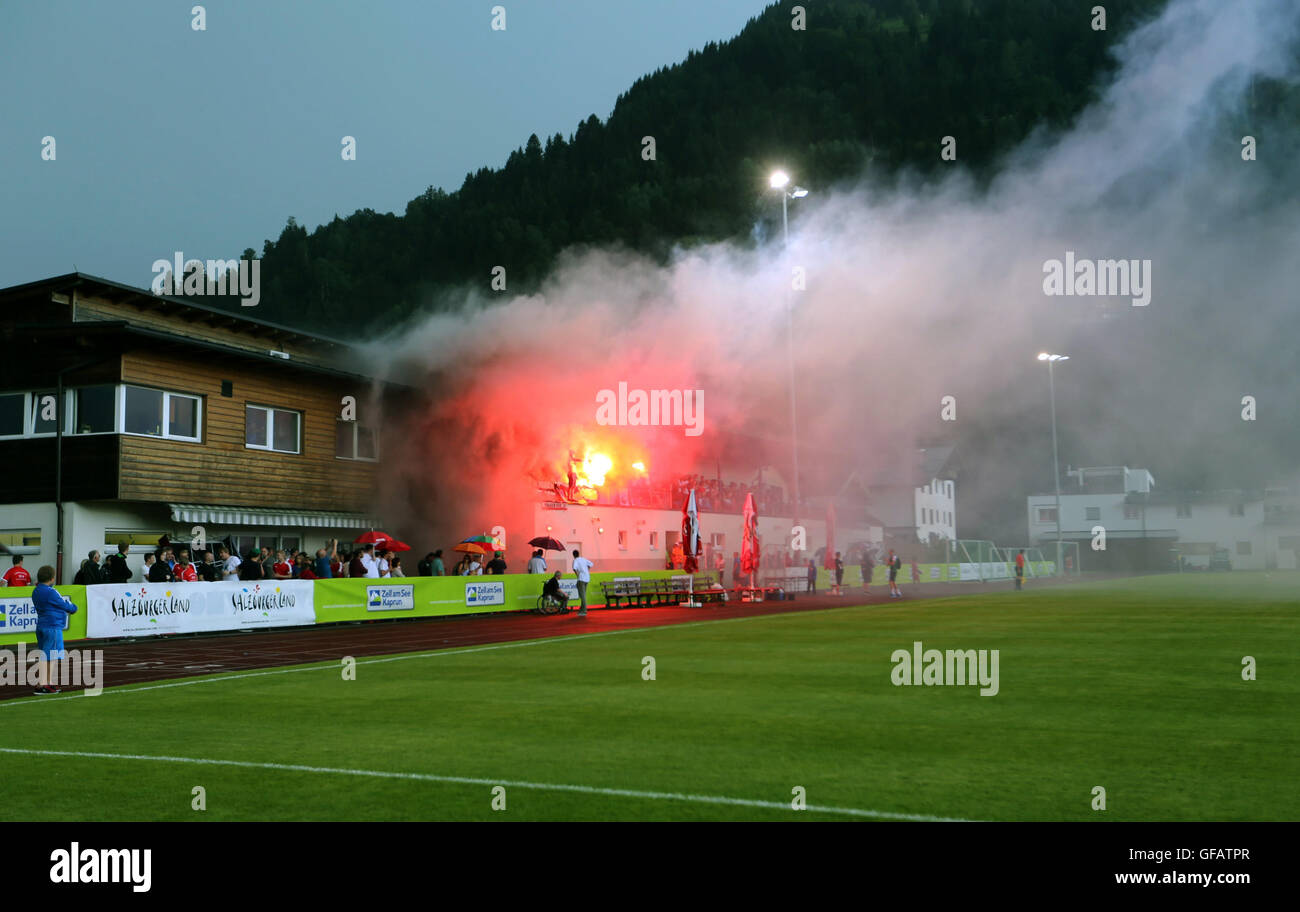 Ultras from Bayer 04 Leverkusen light flares during a test match ...