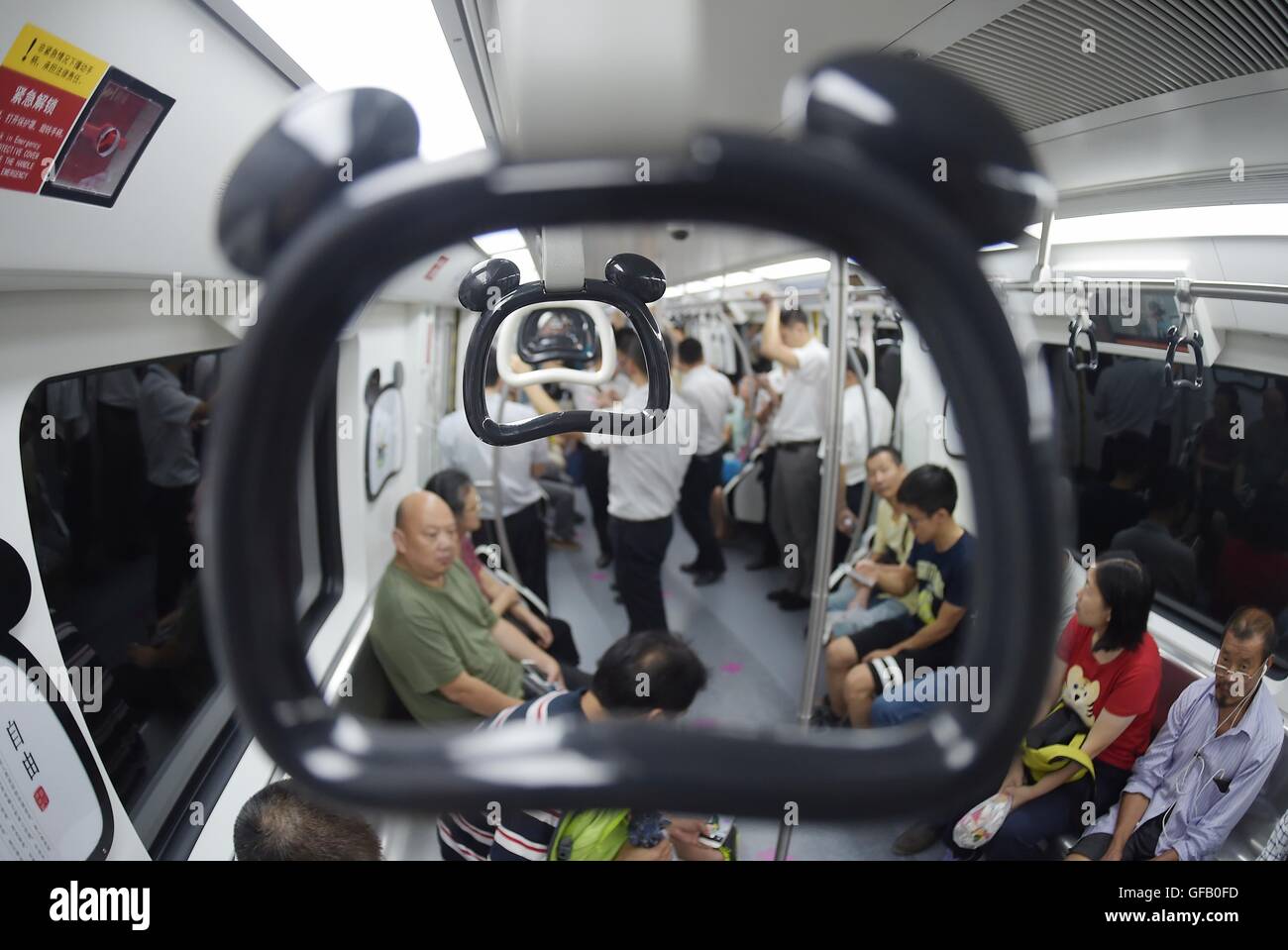 Chengdu, China's Sichuan Province. 31st July, 2016. Passengers take a ...