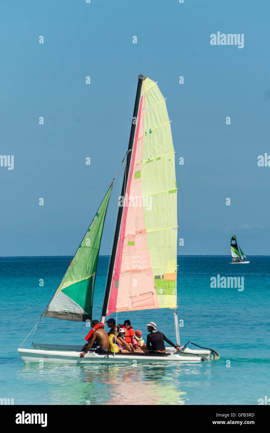 two sailboats sailing on the turquoise waters of the Caribbean Stock ...