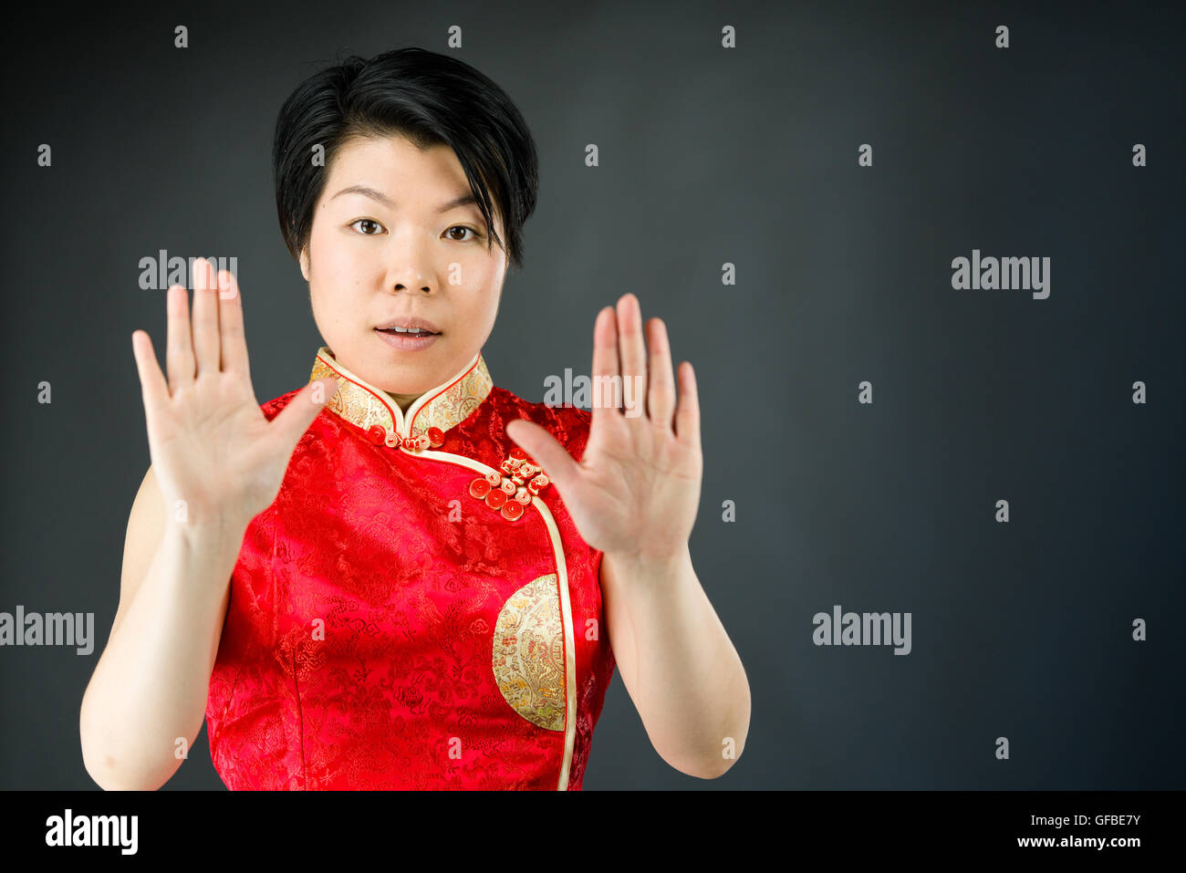 female model attractive woman on plain background with copy space halt ...