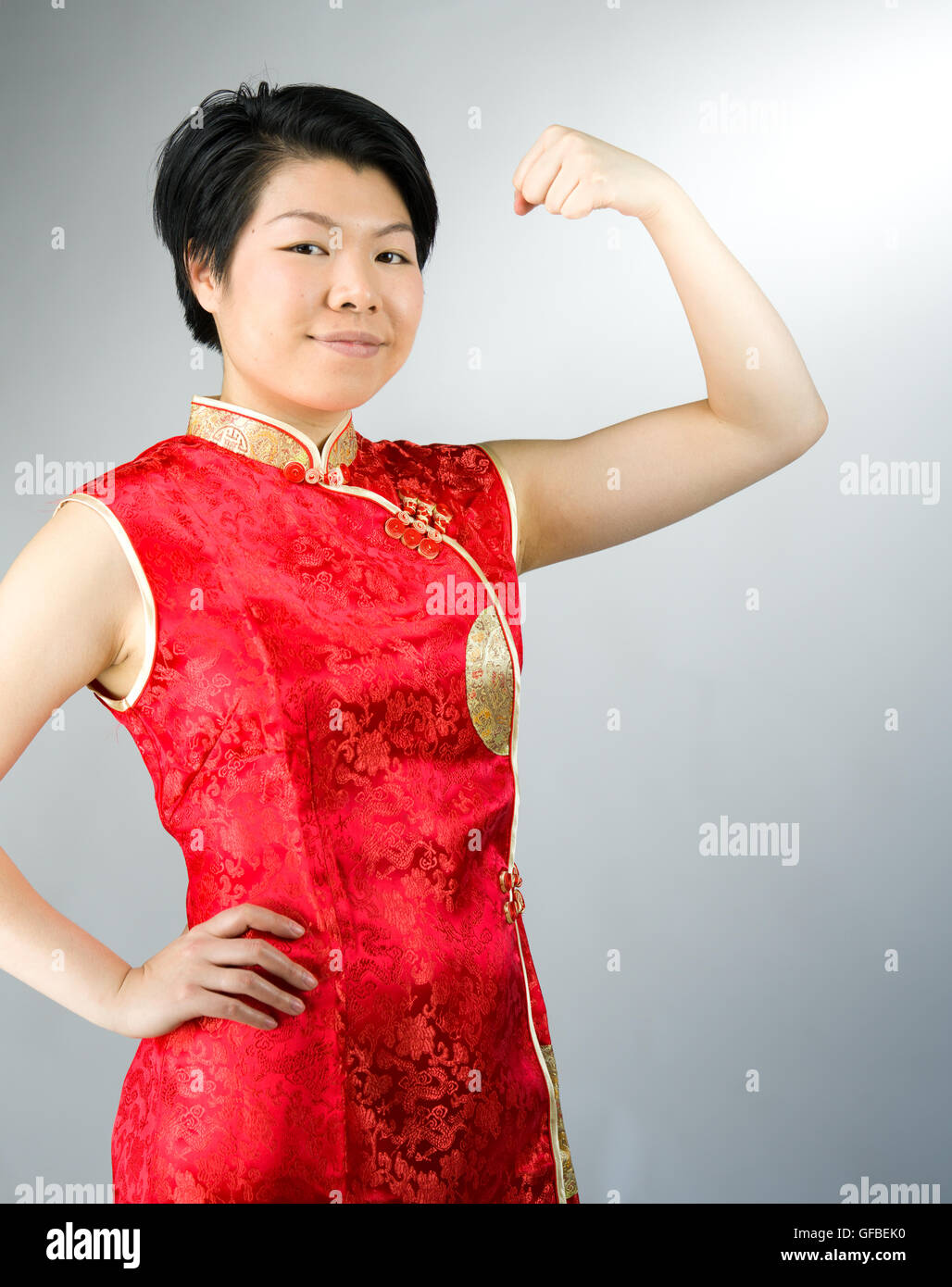 female model attractive woman showing strength with arm curl Stock ...