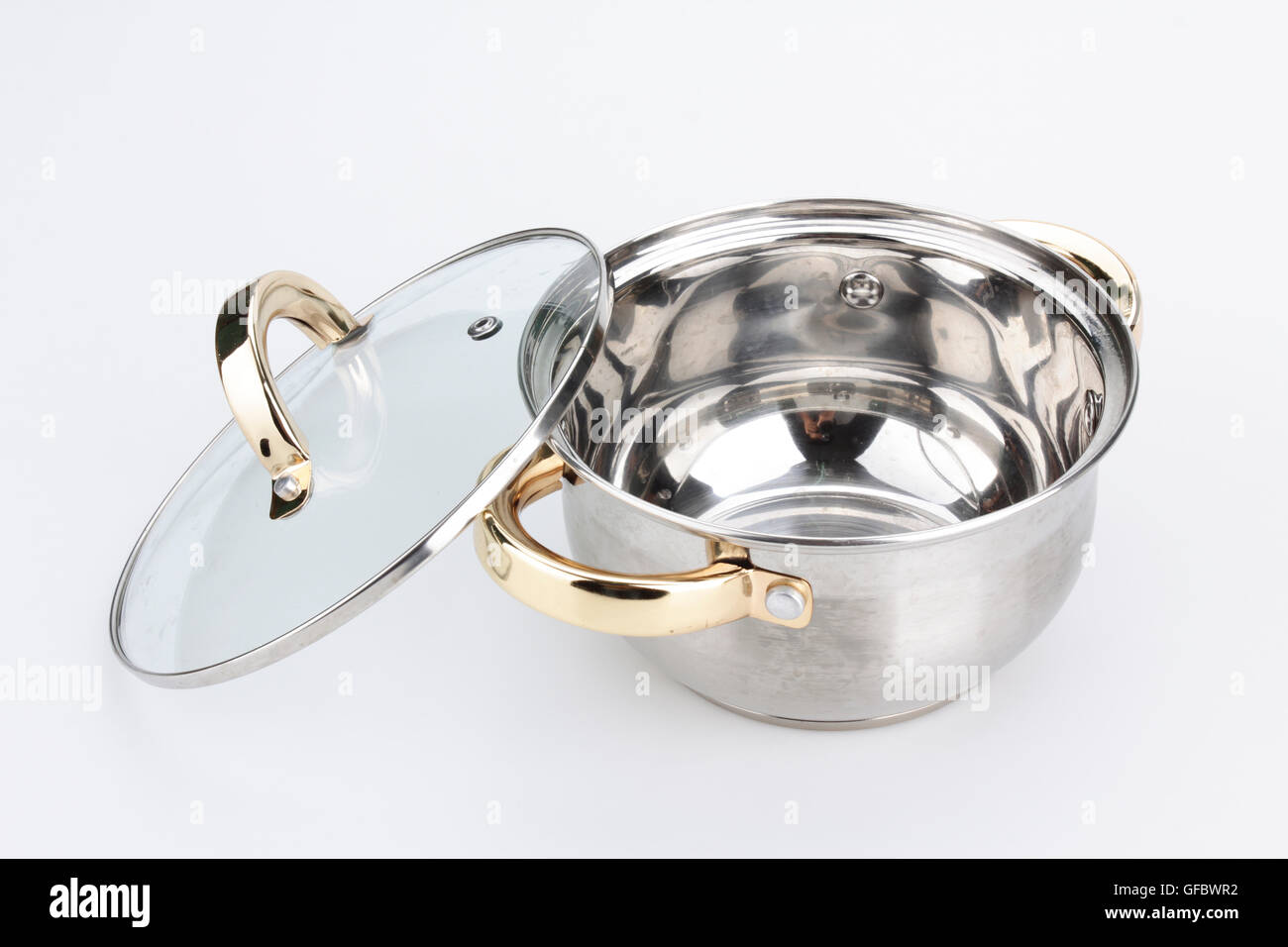 Stainless steel metal cooking pot pan over isolated white background ...