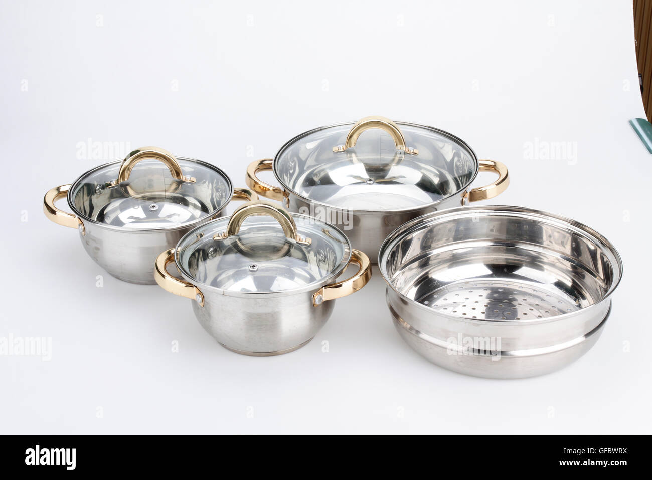 Stainless steel metal cooking pot pan over isolated white background ...