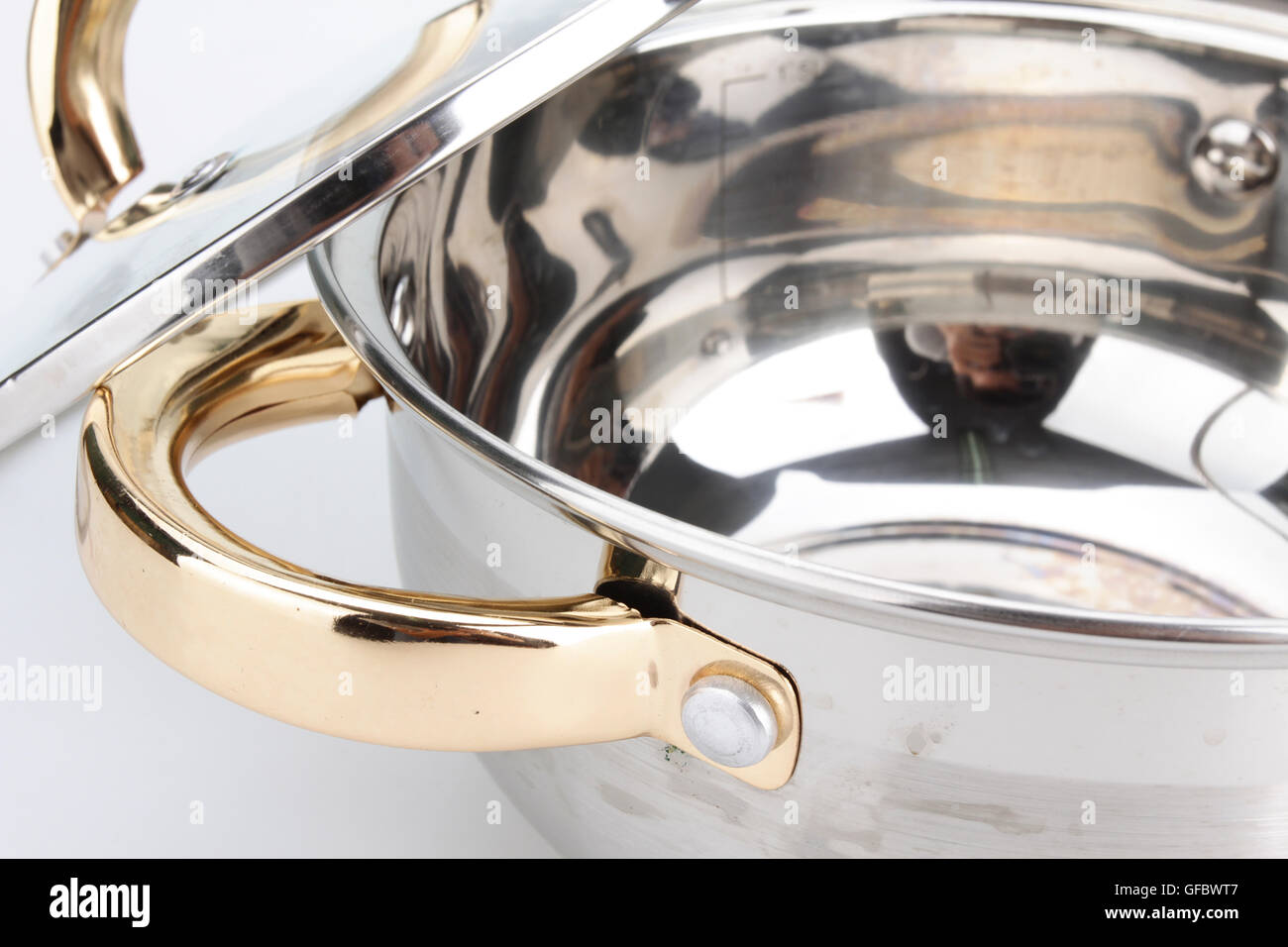 Stainless steel metal cooking pot pan over isolated white background ...