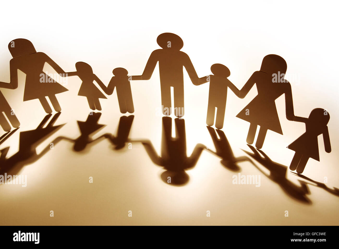 Family paper chain cutout holding hands Stock Photo - Alamy