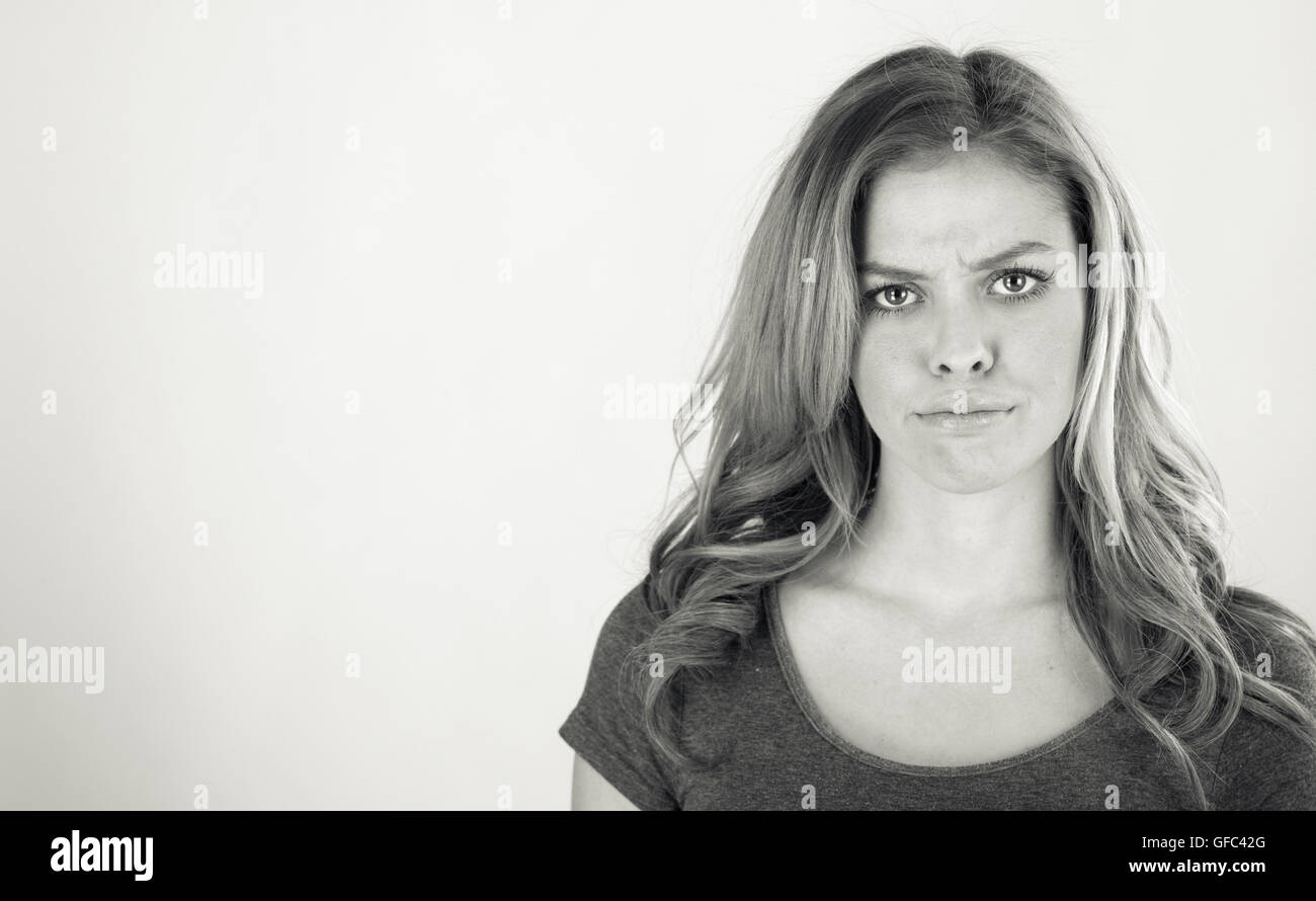 female model attractive woman on plein background with copy space upset ...