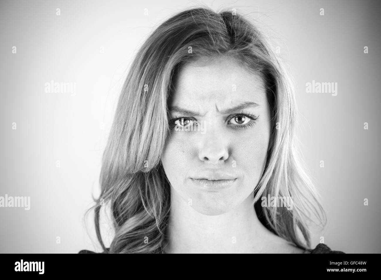 female model attractive woman on plein background with copy space upset ...
