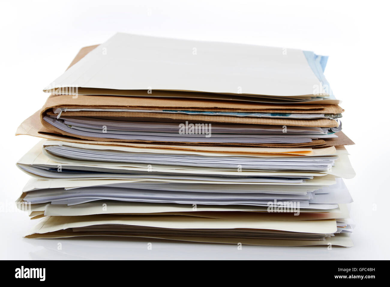 Pile of files on plain background Stock Photo - Alamy