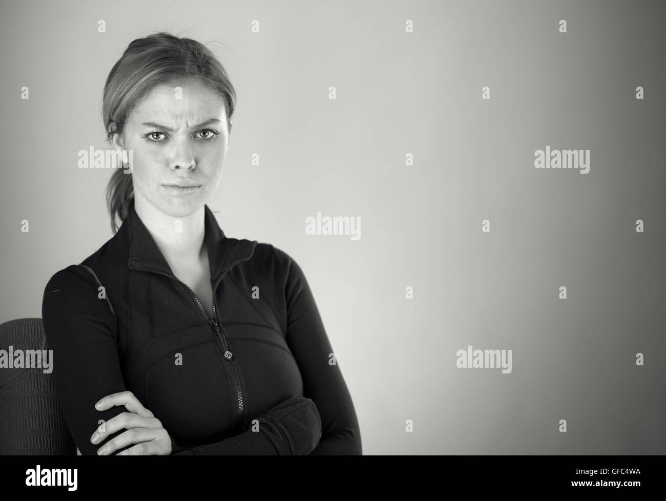 female model attractive woman on plein background with copy space upset ...