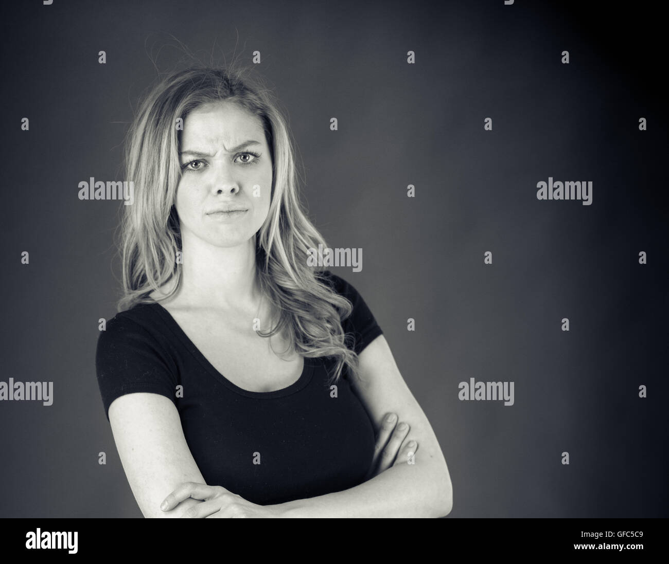 female model attractive woman on plein background with copy space upset ...