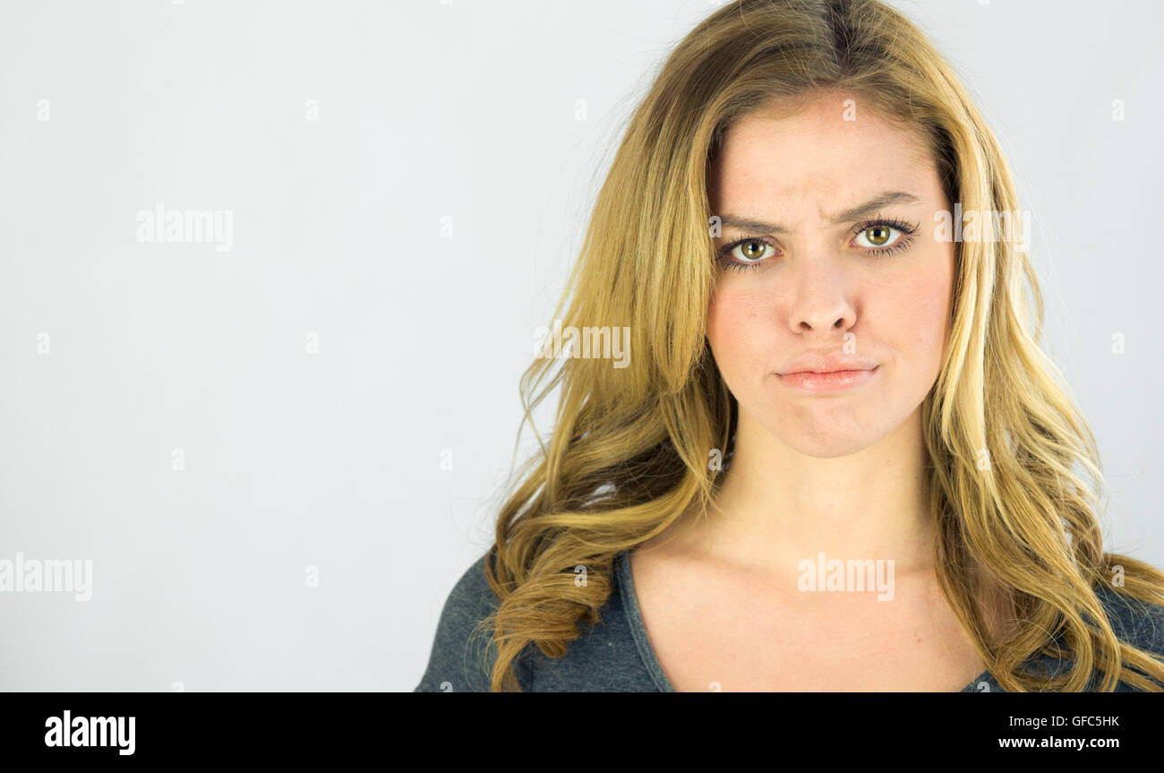 female model attractive woman on plein background with copy space upset ...