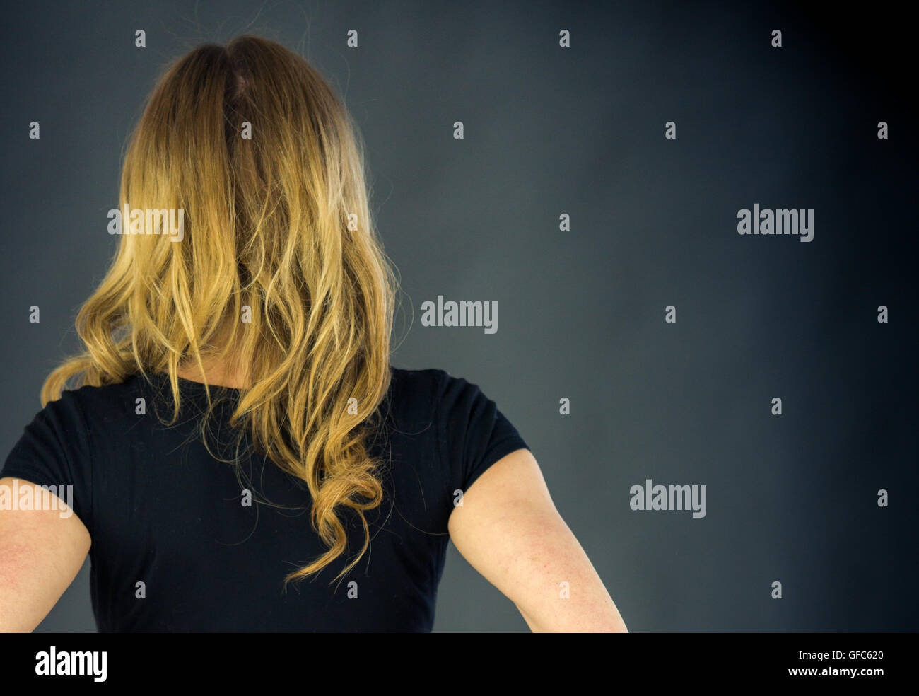 female model attractive woman on plein background with copy space rear ...