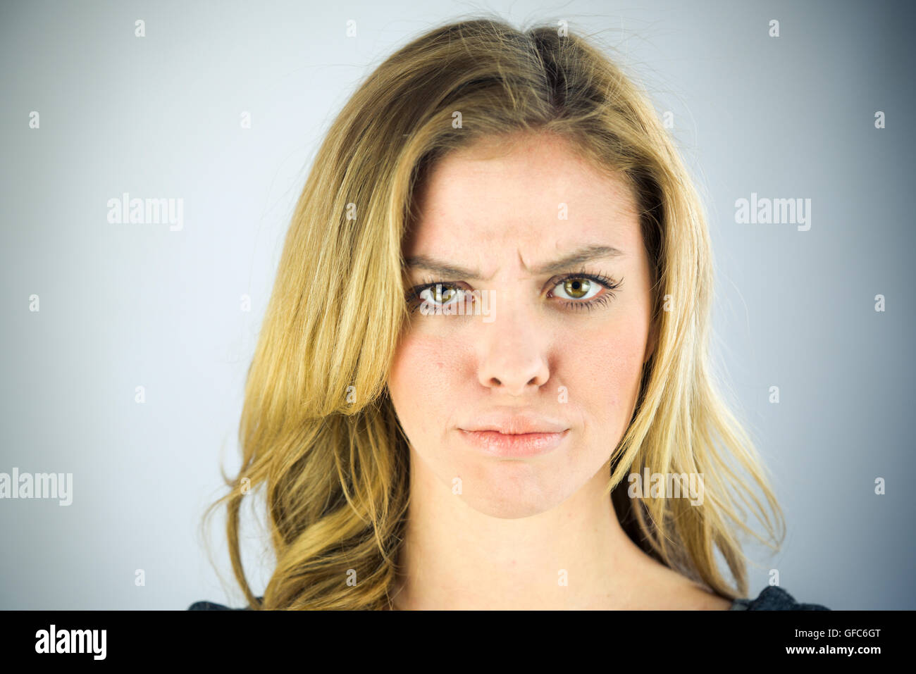 female model attractive woman on plein background with copy space upset ...