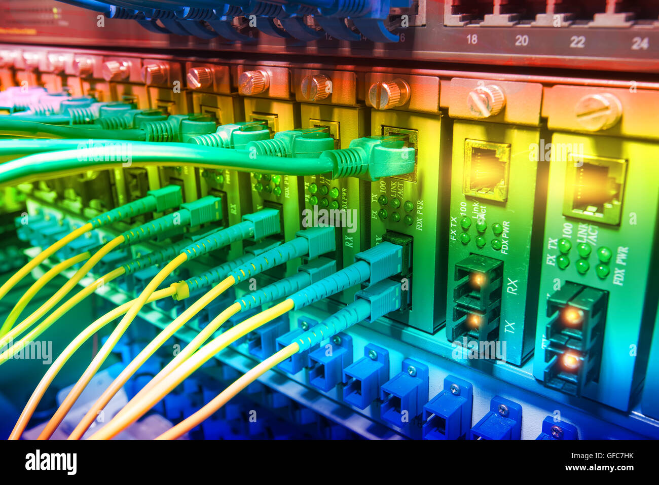 Fiber network switch with some yellow optical network cables Stock ...