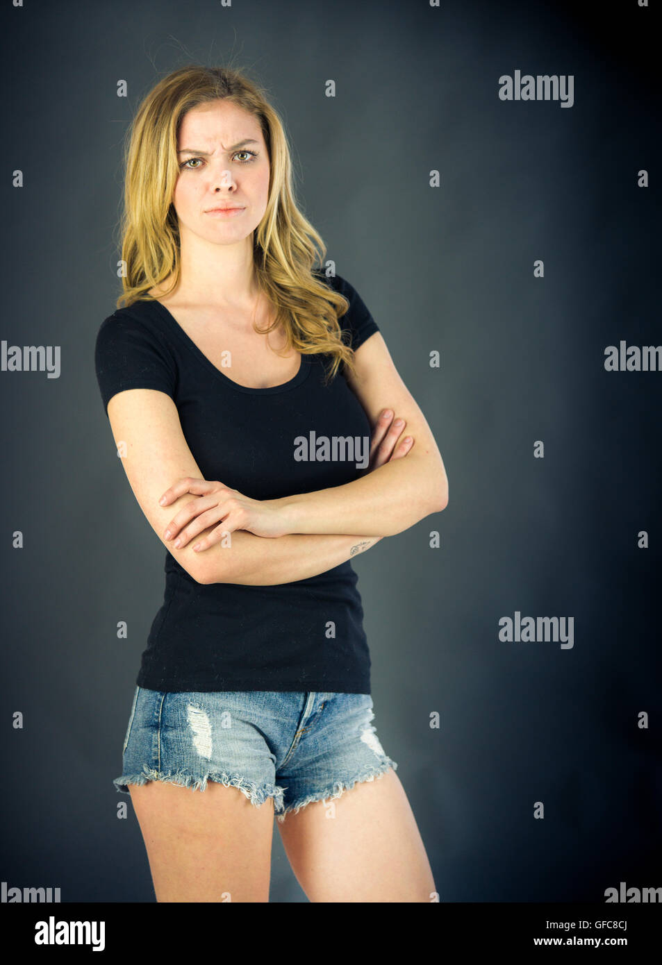 female model attractive woman on plein background with copy space upset ...