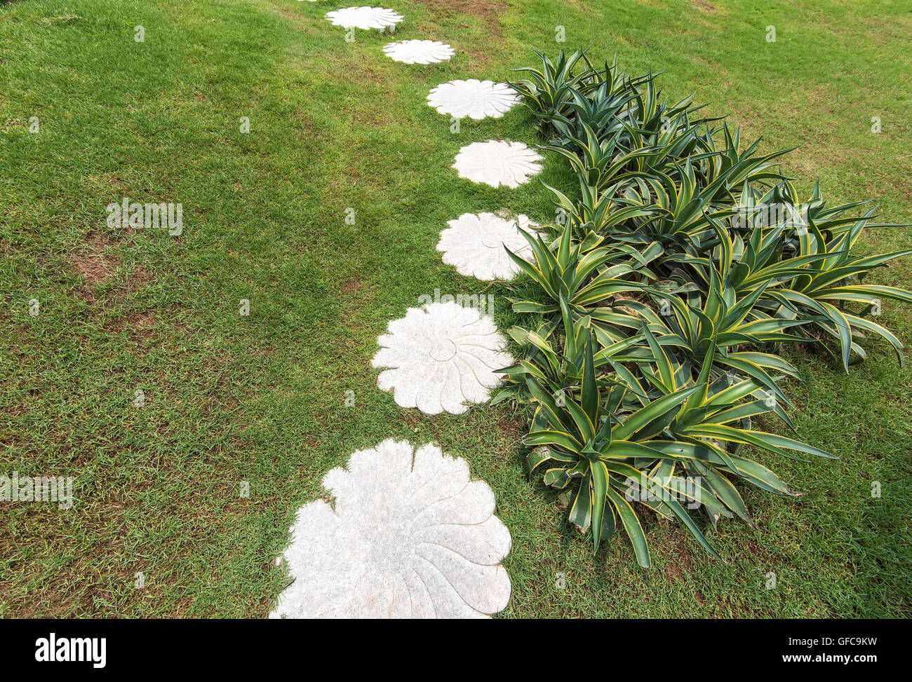 Stone walkway winding in garden Stock Photo - Alamy