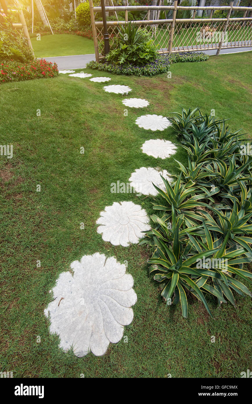 Stone walkway winding in garden Stock Photo - Alamy