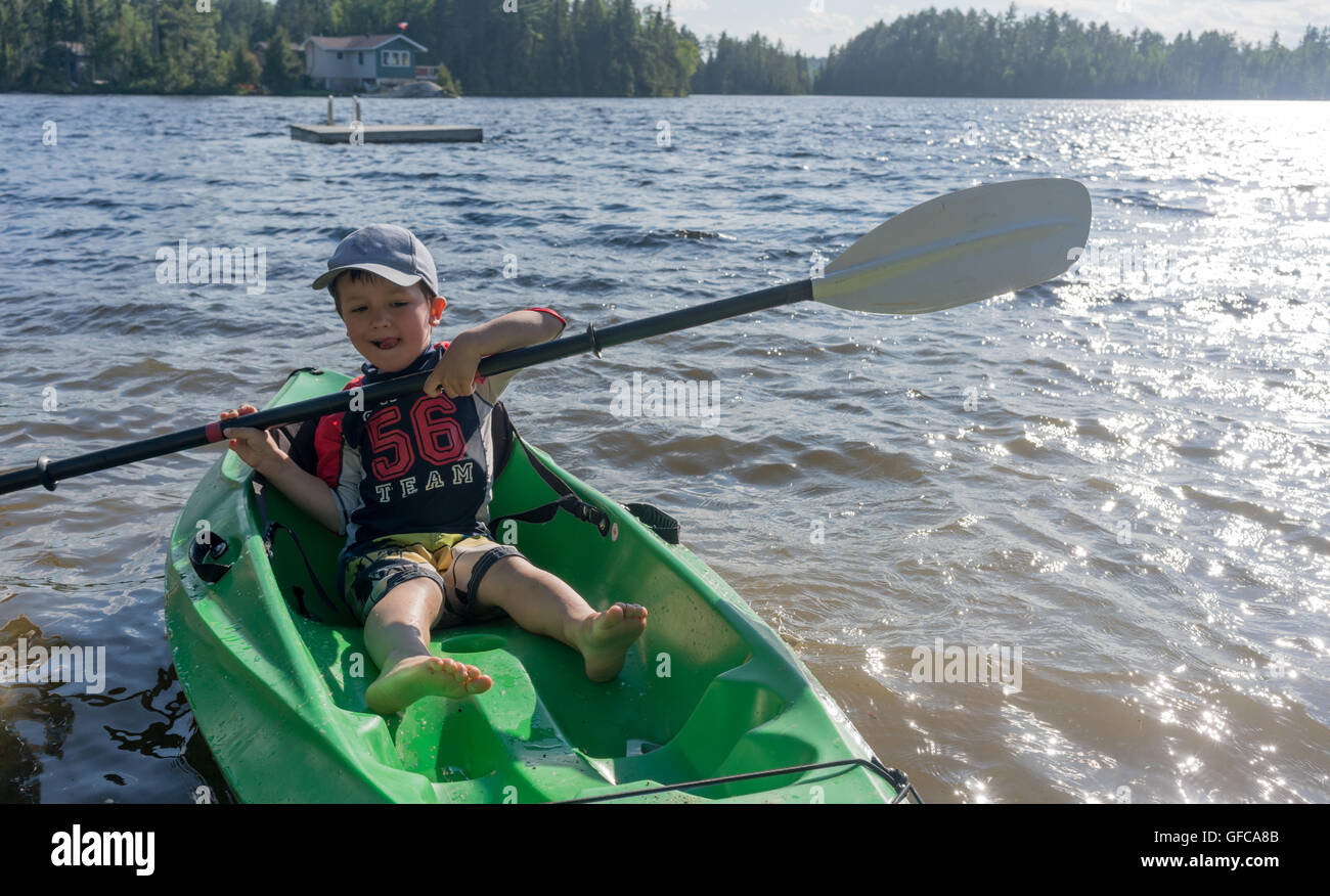 child boy kayak on the lake Stock Photo - Alamy