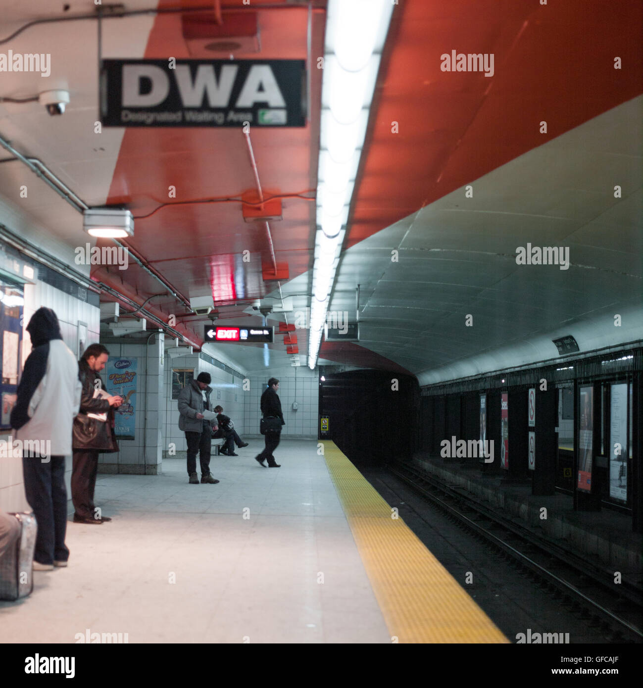 Passengers waiting in a subway station Stock Photo - Alamy