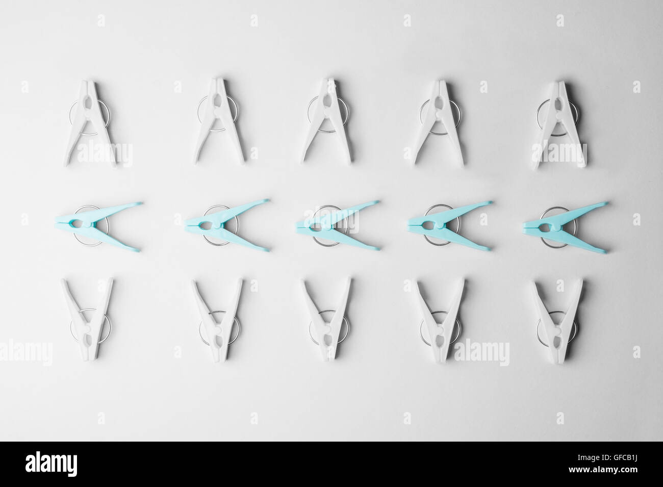 Laundry clips organized over white background, top view Stock Photo - Alamy