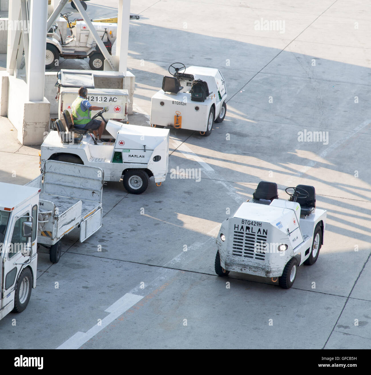 Cargo towing tractors at an airport 2011-06-15 6:51:19 AM Stock Photo ...