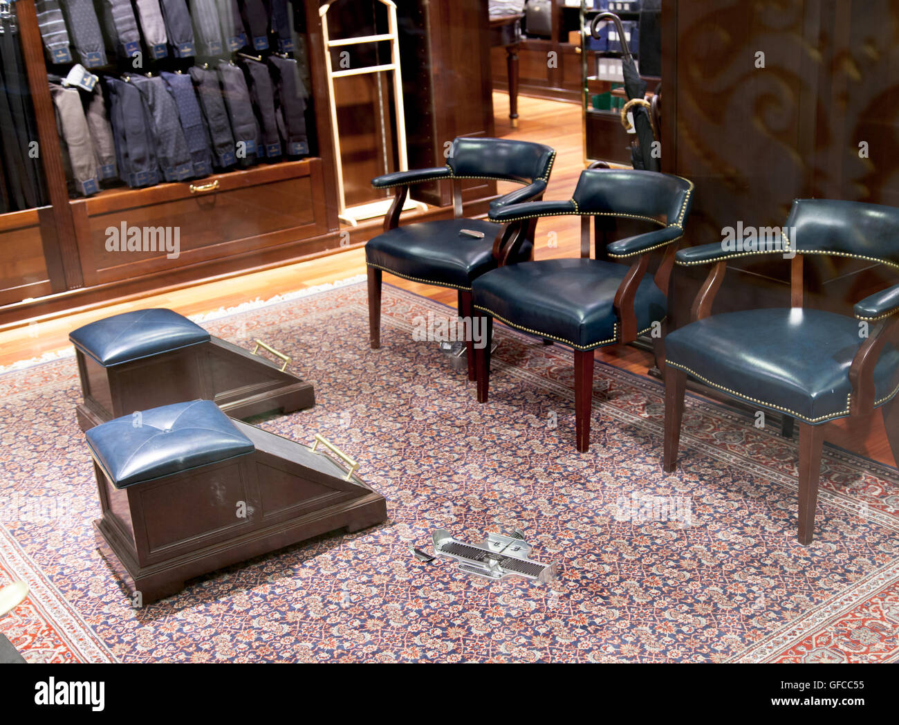 Chairs in a clothing store Stock Photo - Alamy