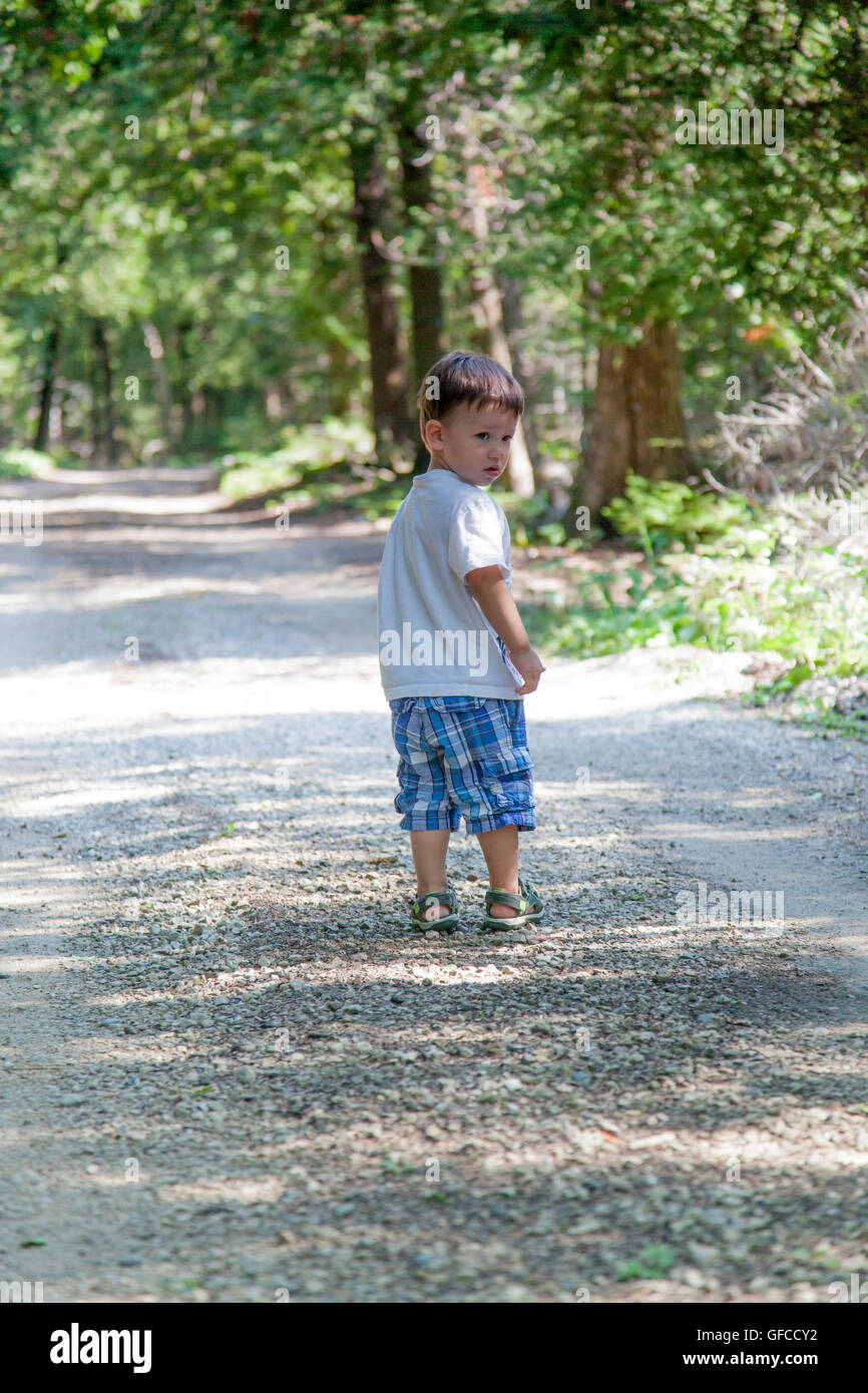 Boy playing in a park Stock Photo - Alamy