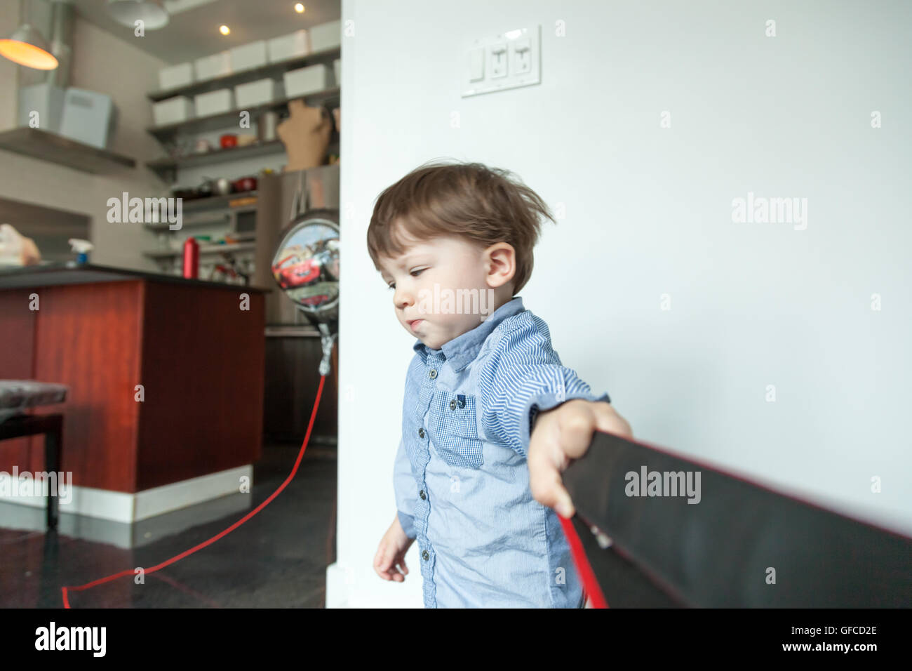 Boy pulling a bag Stock Photo - Alamy